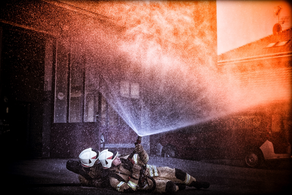 Two Firefighters, Water Spray posters & prints by Images Tranquil ...